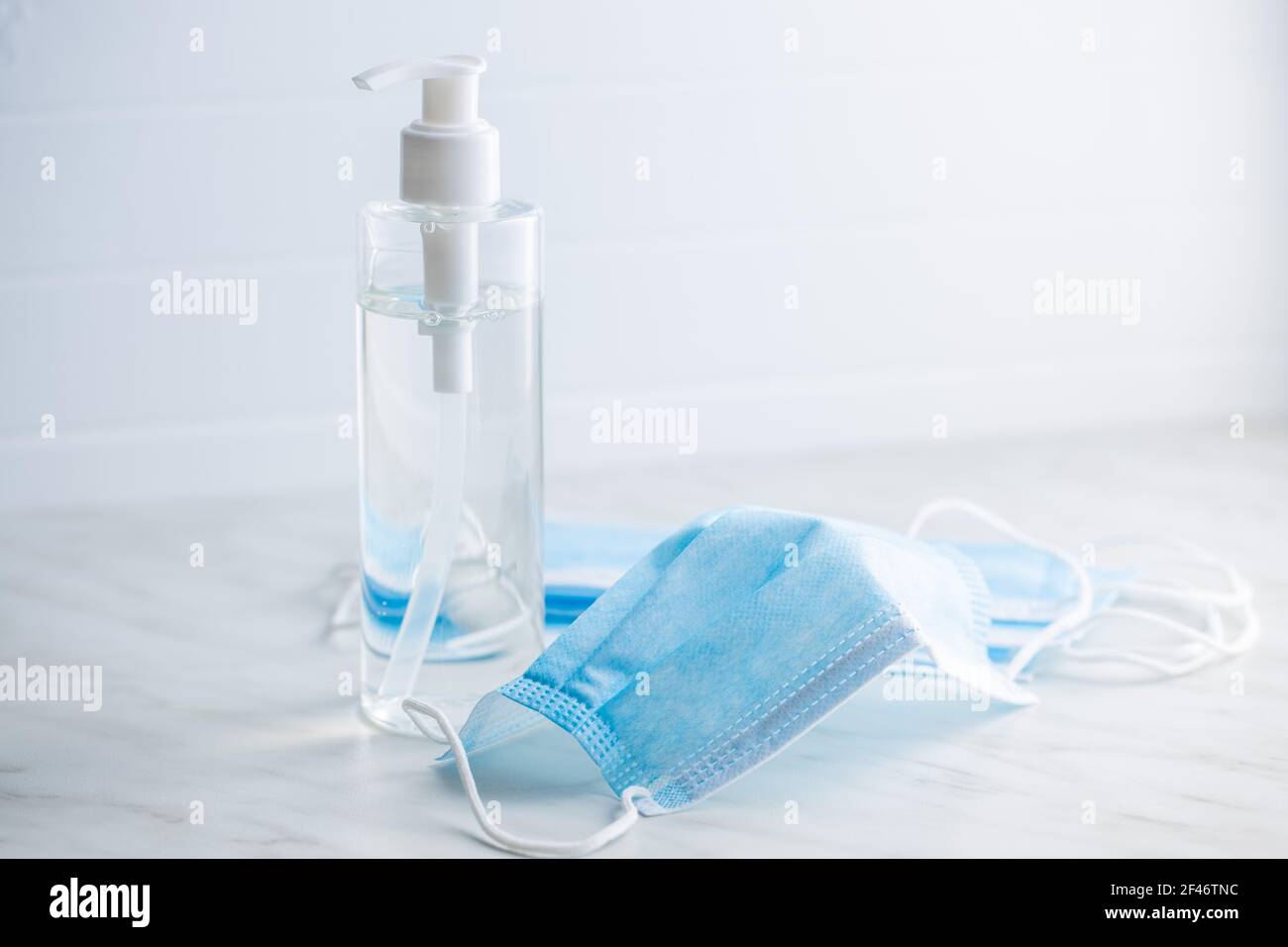 Coronavirus prevention hand sanitizer and medical face mask. Hand ...