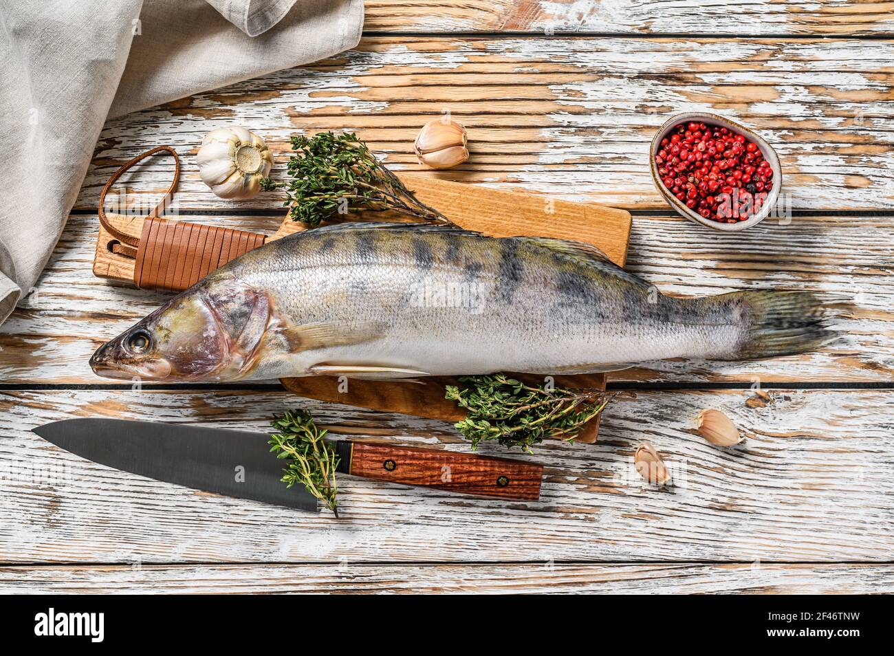 Raw pike perch, pikeperch fish on a cutting board. Fresh fish. White ...