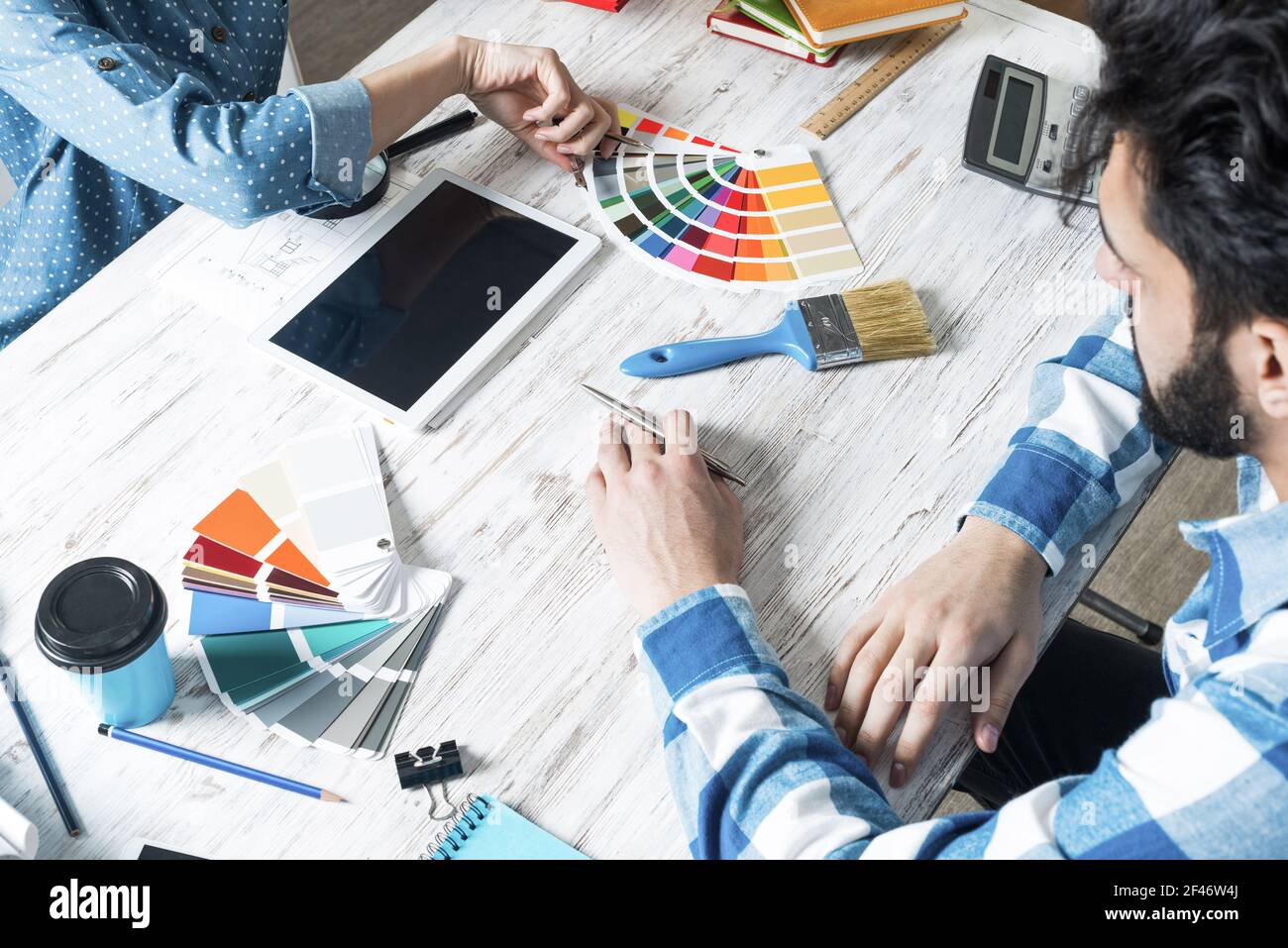 Web designer choosing colors from swatches Stock Photo - Alamy