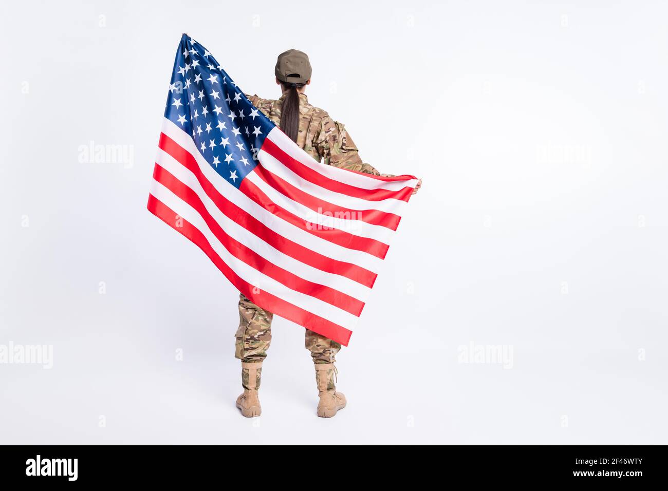 Full length rear portrait of girl hands raise hold usa national flag ...