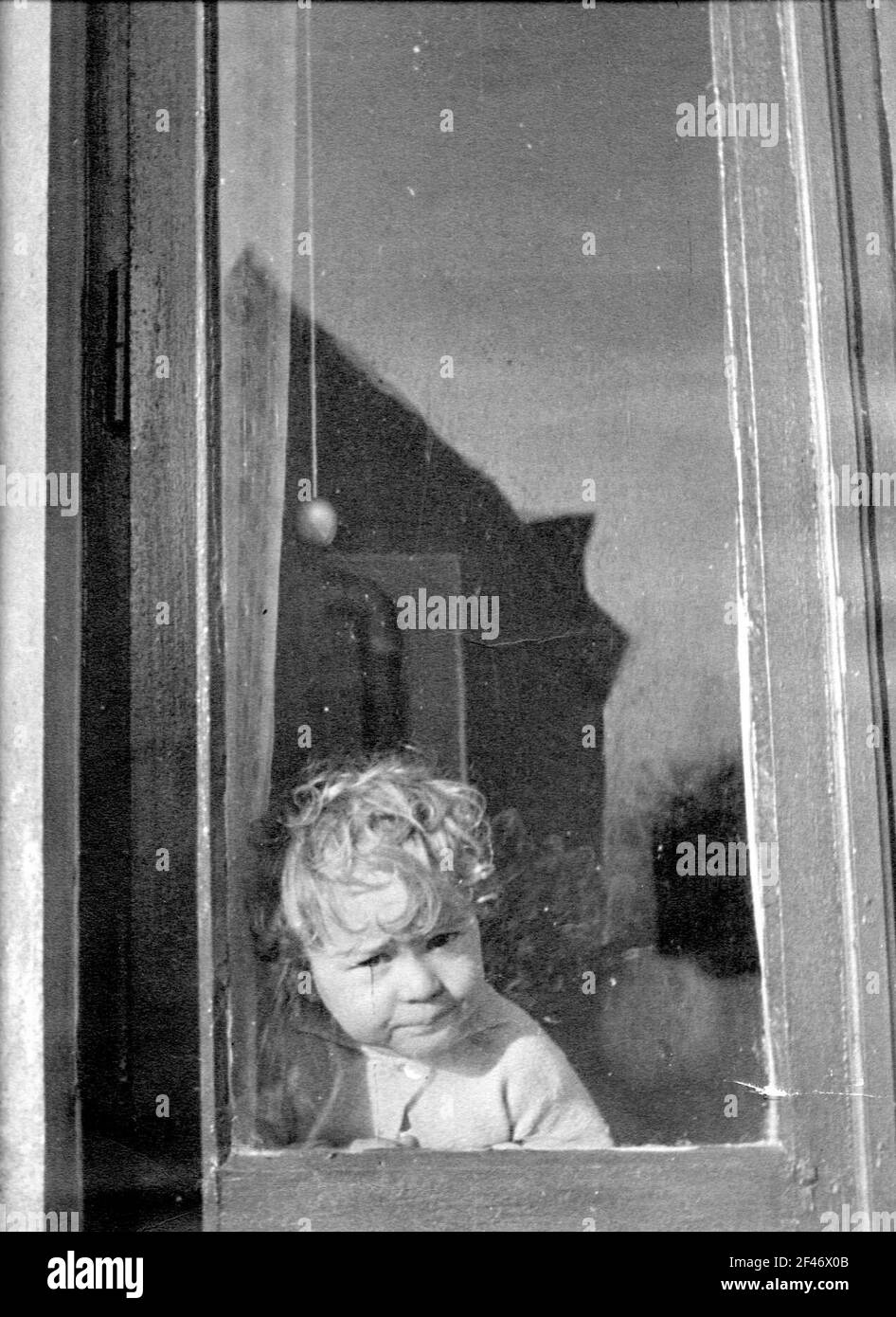 Boy at the window Stock Photo - Alamy
