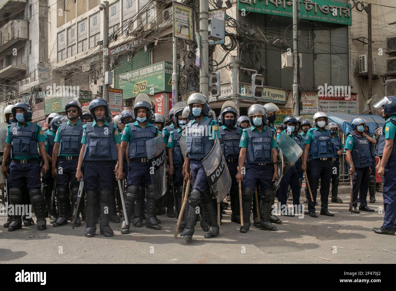 Dhaka, Bangladesh. 19th Mar, 2021. Riot police stand on guard during ...