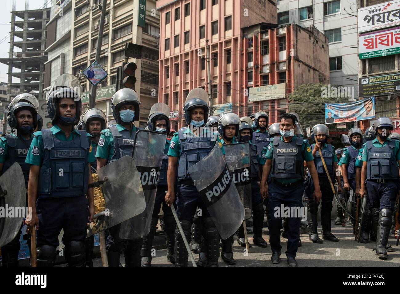 Dhaka, Bangladesh. 19th Mar, 2021. Riot police stand on guard during ...