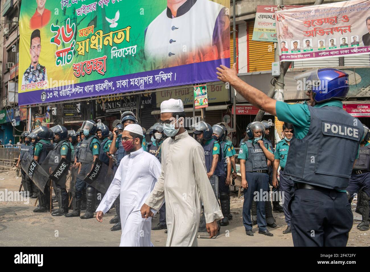 Dhaka, Bangladesh. 19th Mar, 2021. Riot police stand on guard during ...