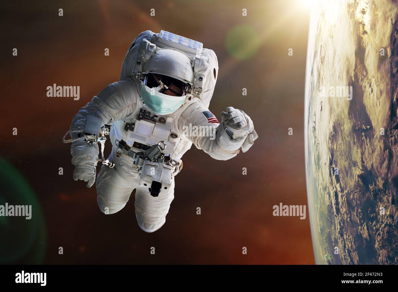 Astronaut with face mask protect in outer space. World medical concept ...