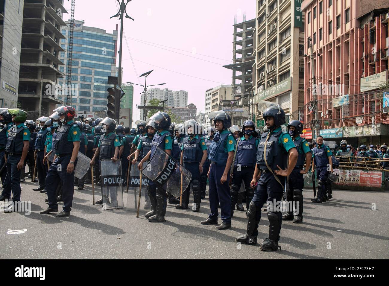 Dhaka, Bangladesh. 19th Mar, 2021. Riot police stand on guard during ...