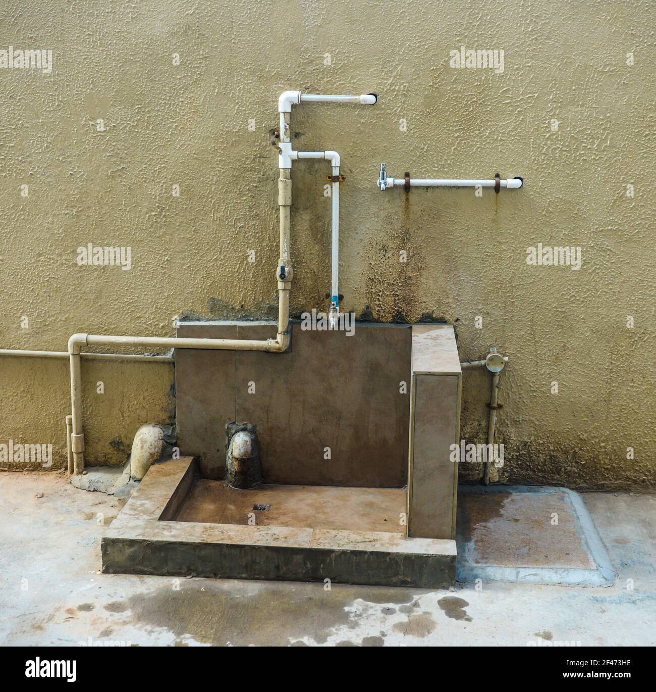 The construction of a water pipe outside the house on the wall ...