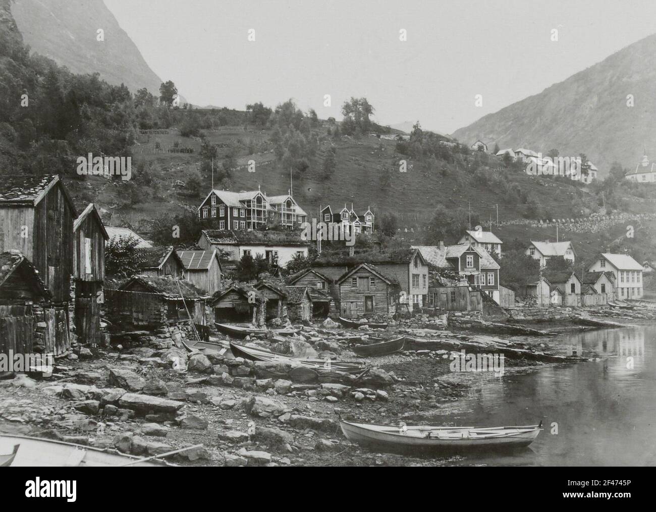 Merok. Beach with rowing boats. View over wooden huts, Hotel Geiranger ...