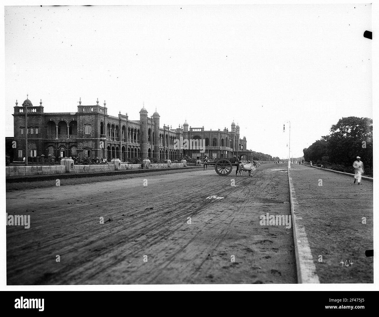 Rangonn, Burma. Road with cross-beam carts and representative building ...