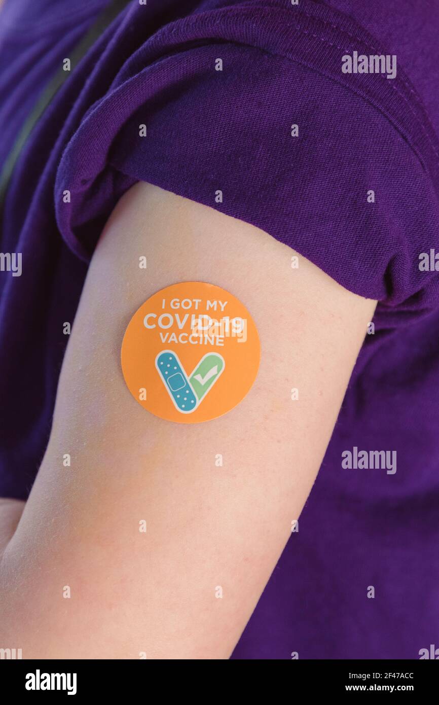 COVID-19 vaccine sticker on patient Stock Photo - Alamy