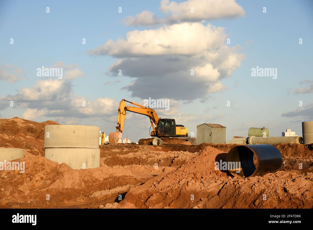 Excavator dig the trenches at a construction site. Trench for laying ...