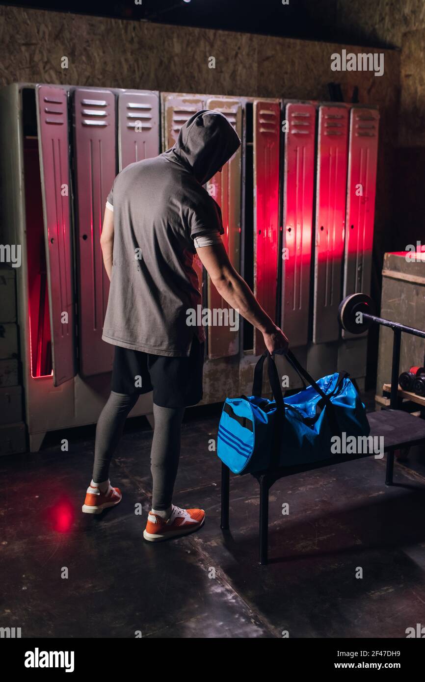 Man get ready for boxing training in the locker room Stock Photo - Alamy