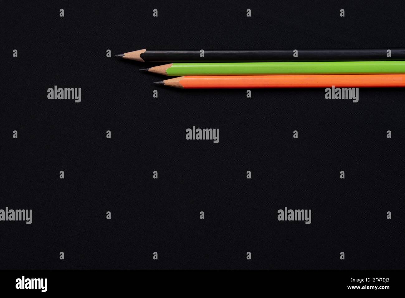 A closeup of graphite pencils isolated on a black background Stock ...