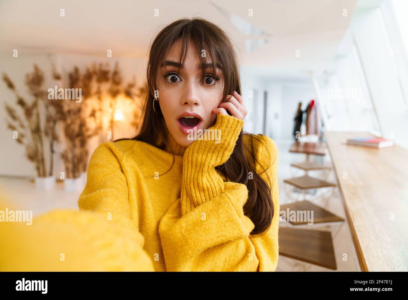 Charming shocked nice girl taking selfie photo and expressing surprise ...