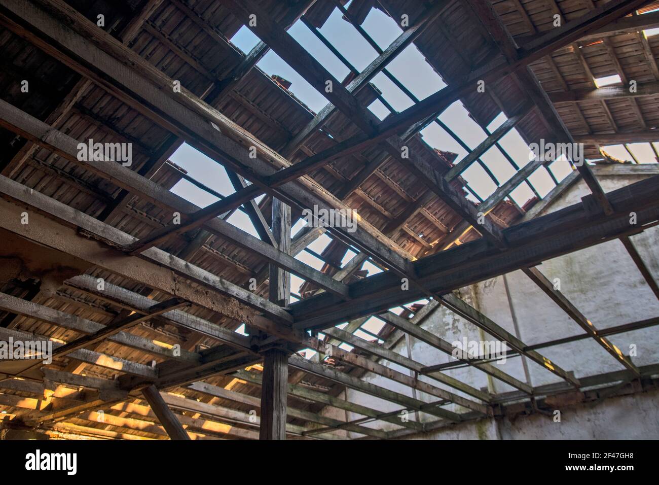 An old ruined warehouse that was almost demolished. The sky can be seen ...