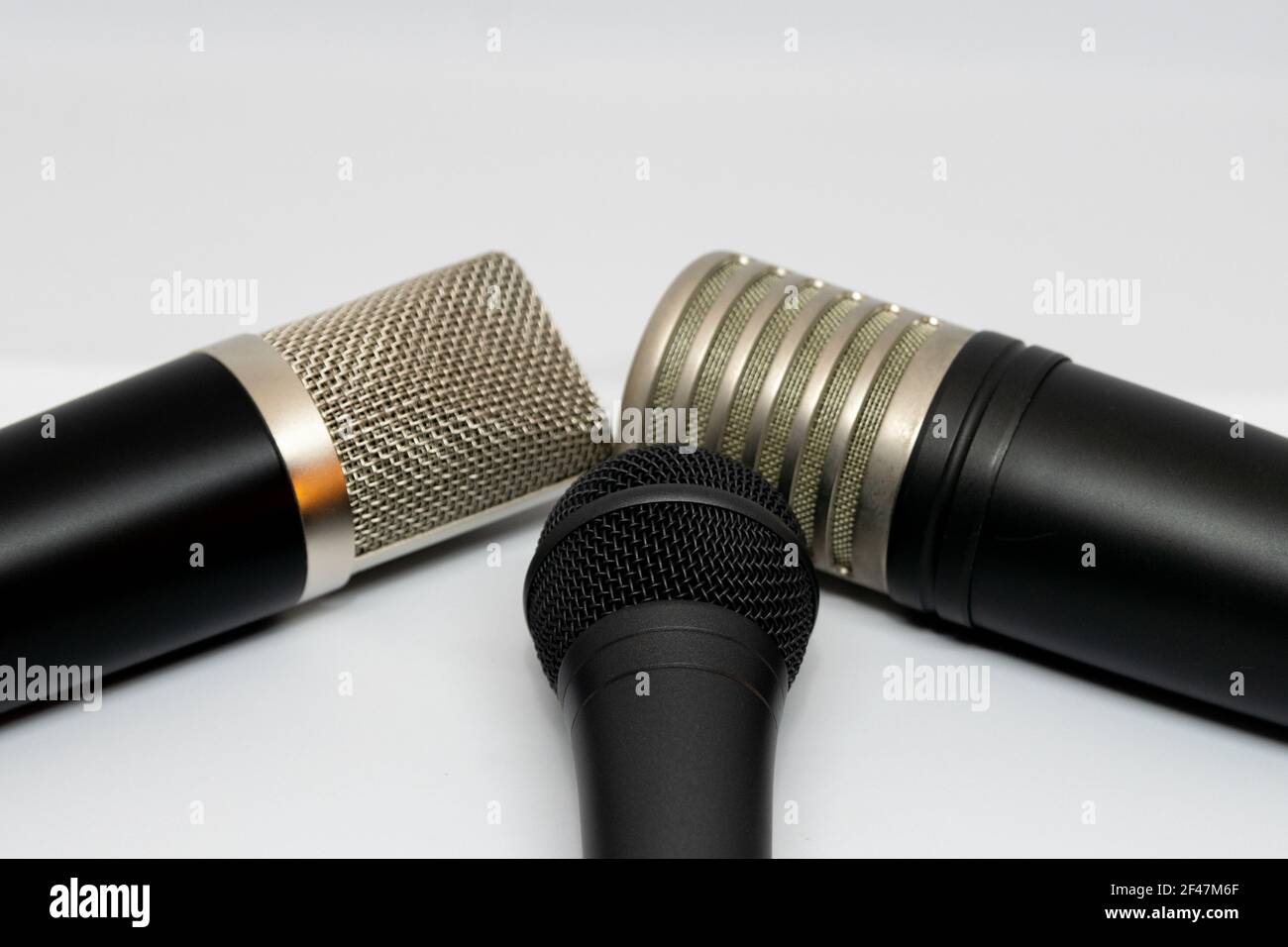 A closeup shot of different types of microphone isolated on white ...