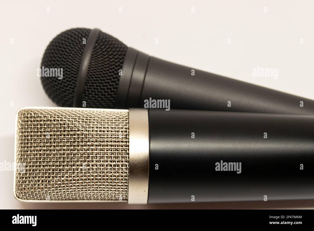 A closeup shot of different types of microphone isolated on white ...