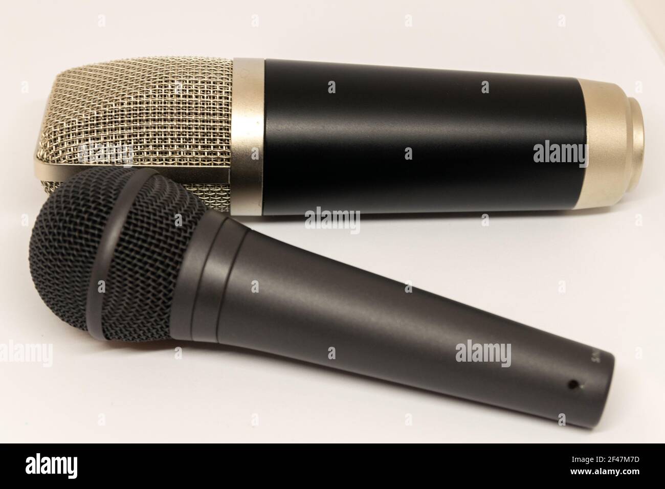 A closeup shot of different types of microphone isolated on white ...