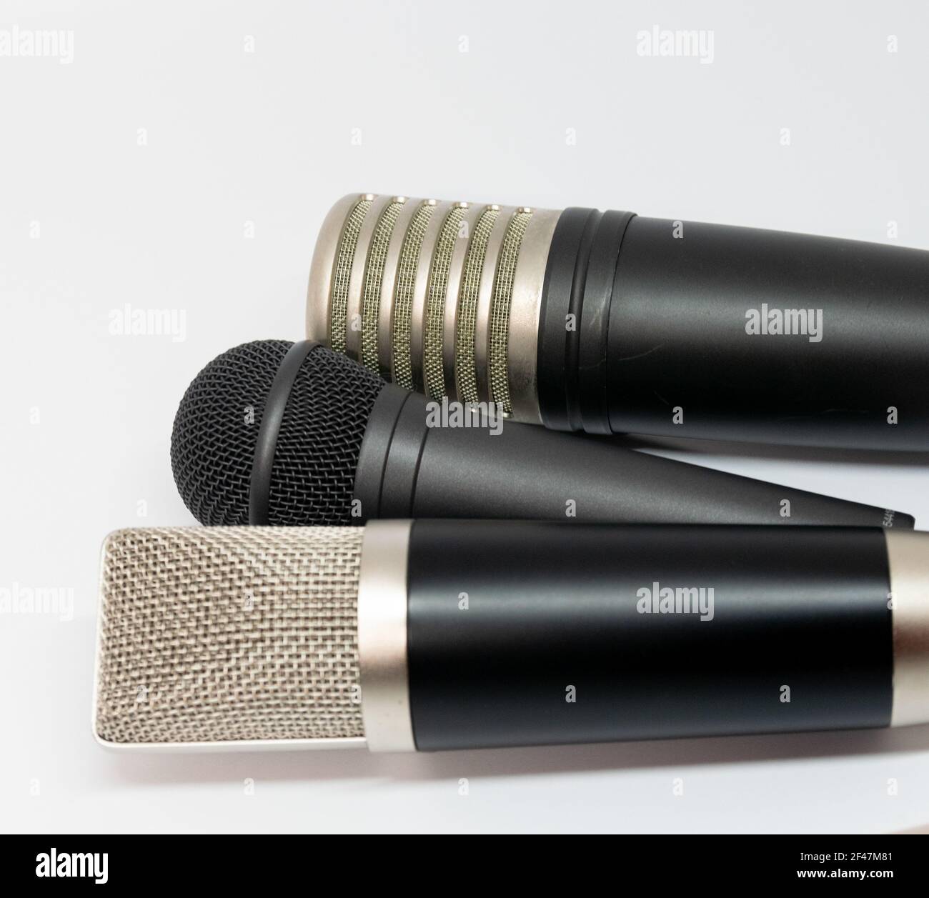 A closeup shot of different types of microphone isolated on white ...