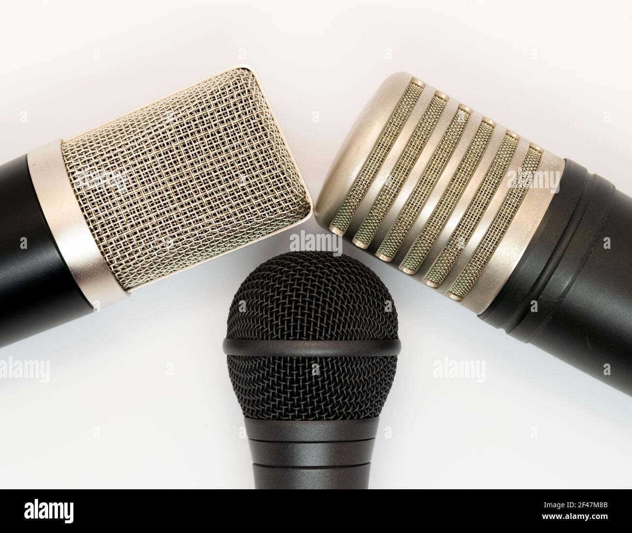 A top view of different types of microphone isolated on white ...