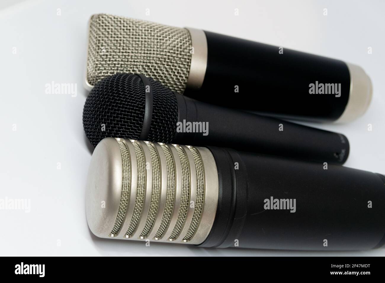 A closeup shot of different types of microphone isolated on white ...