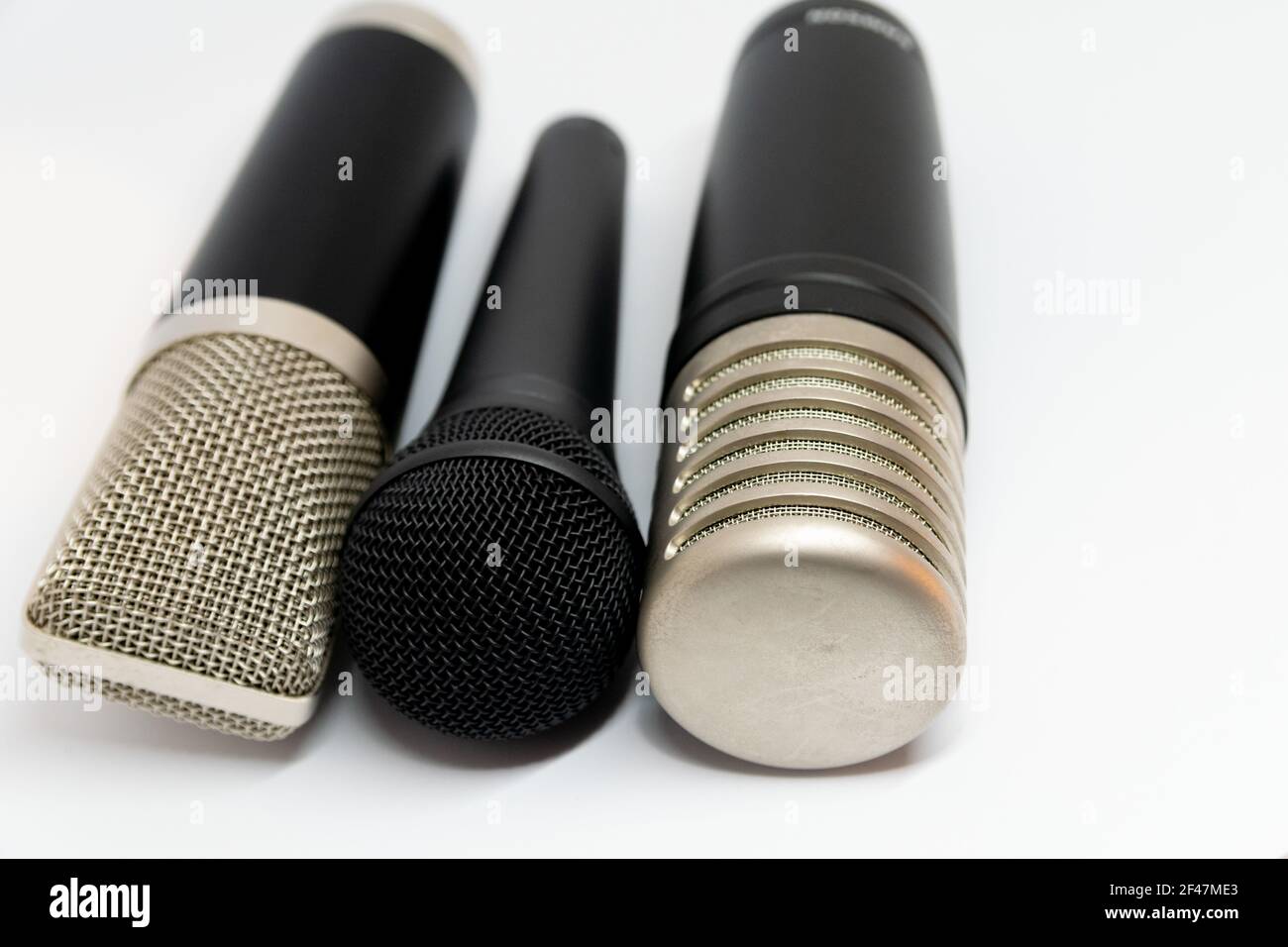 A closeup shot of different types of microphone isolated on white ...