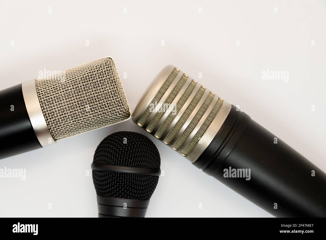 A top view of different types of microphone isolated on white ...