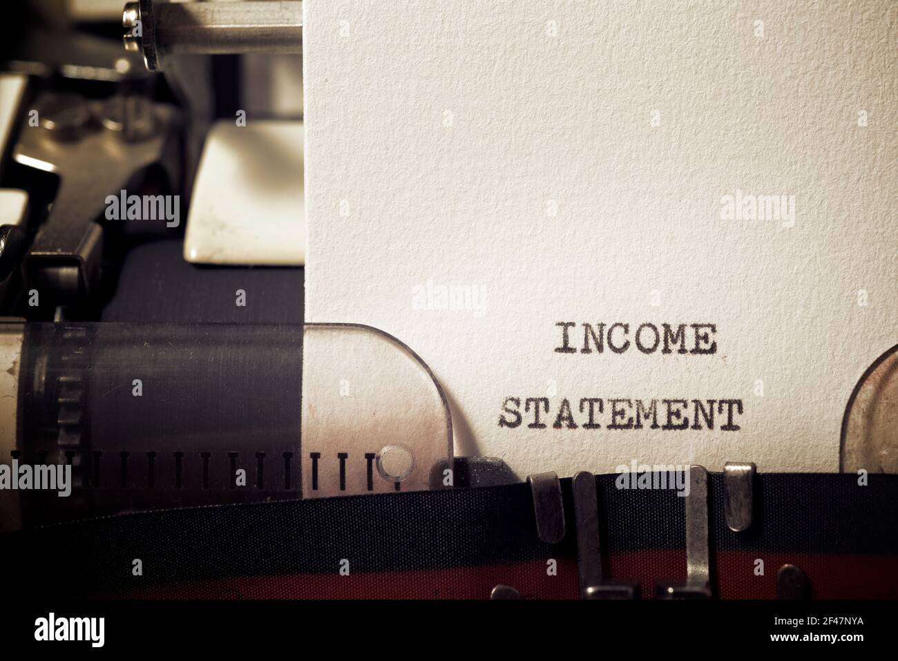 Income statement phrase written with a typewriter Stock Photo - Alamy