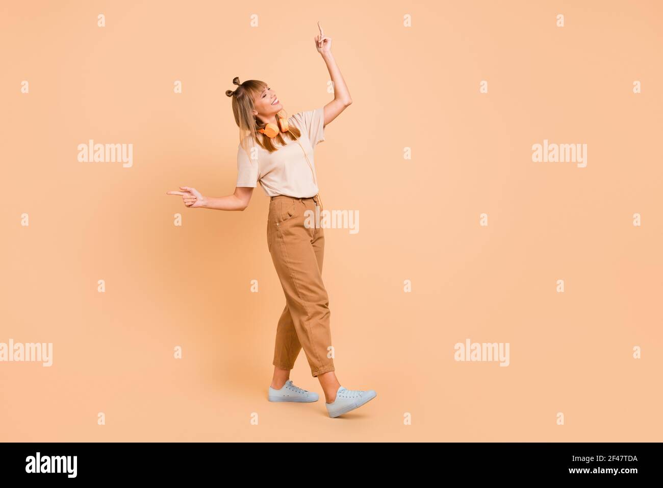 Full length photo of adorable lady dancing direct finger up wear ...