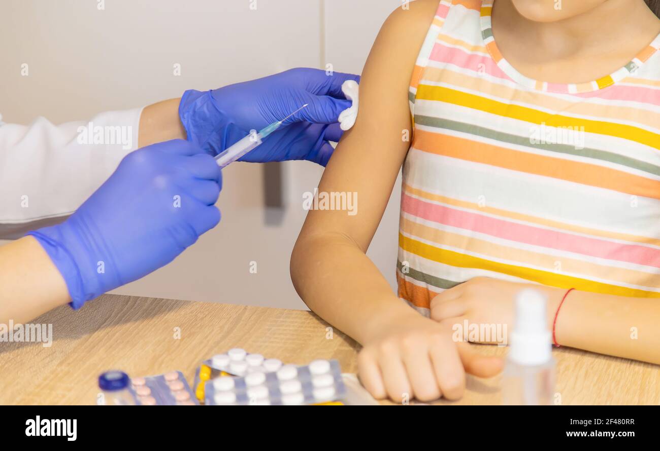 Injection vaccine against virus, injecting child Stock Photo - Alamy