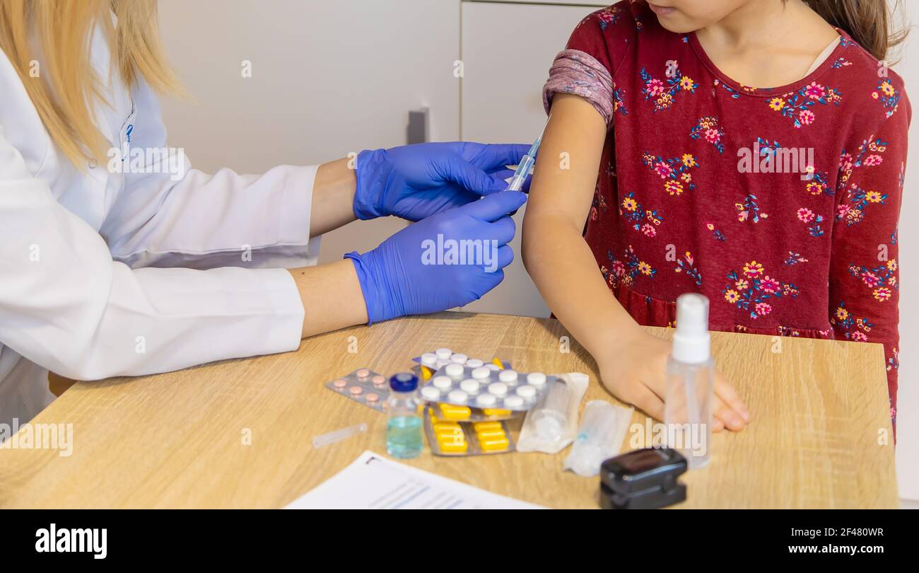 Injection vaccine against virus, injecting child Stock Photo - Alamy