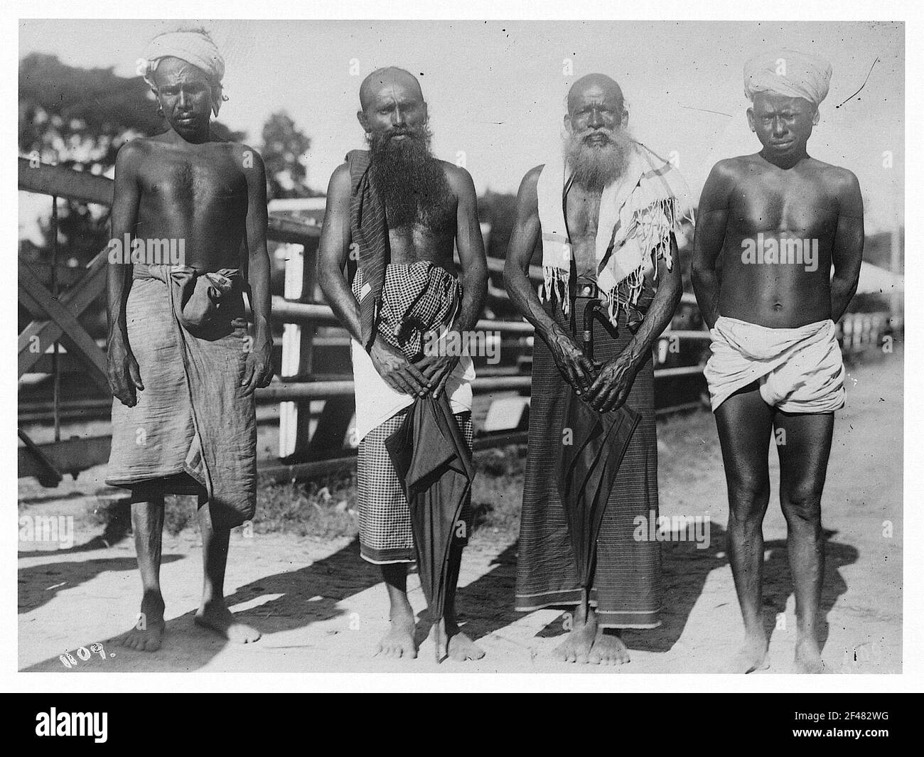 At Colombo (Sri Lanka). Four native men posing on a street Stock Photo ...