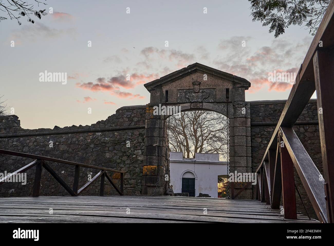 wooden bridge and Gate to the colonial old town of colonia del ...