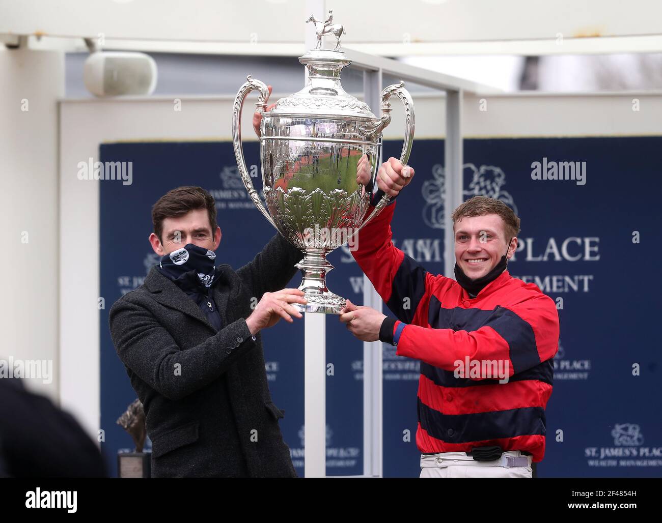Jockey Lorcan Williams and trainer Will Biddick with the trophy after ...