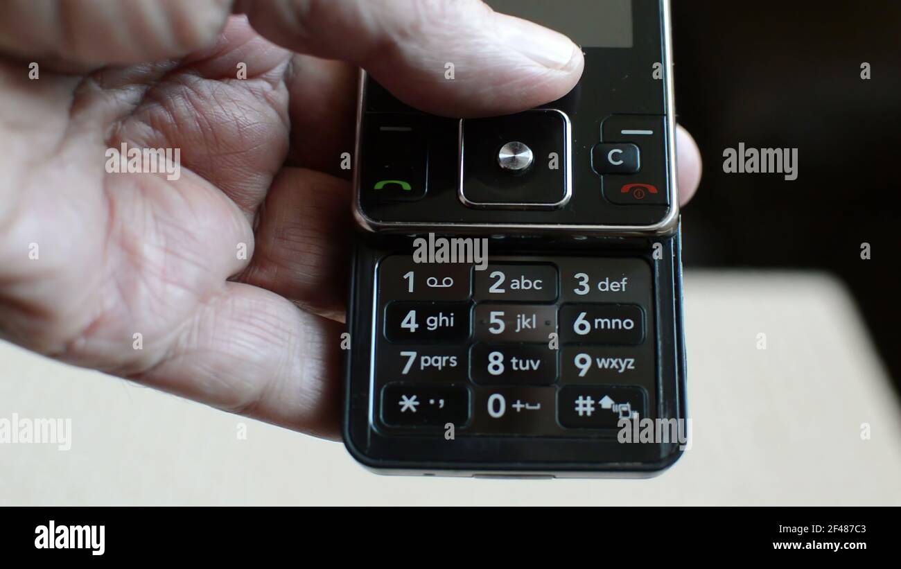 opening of nostalgic old cell phone and Typing/texting a message Stock ...