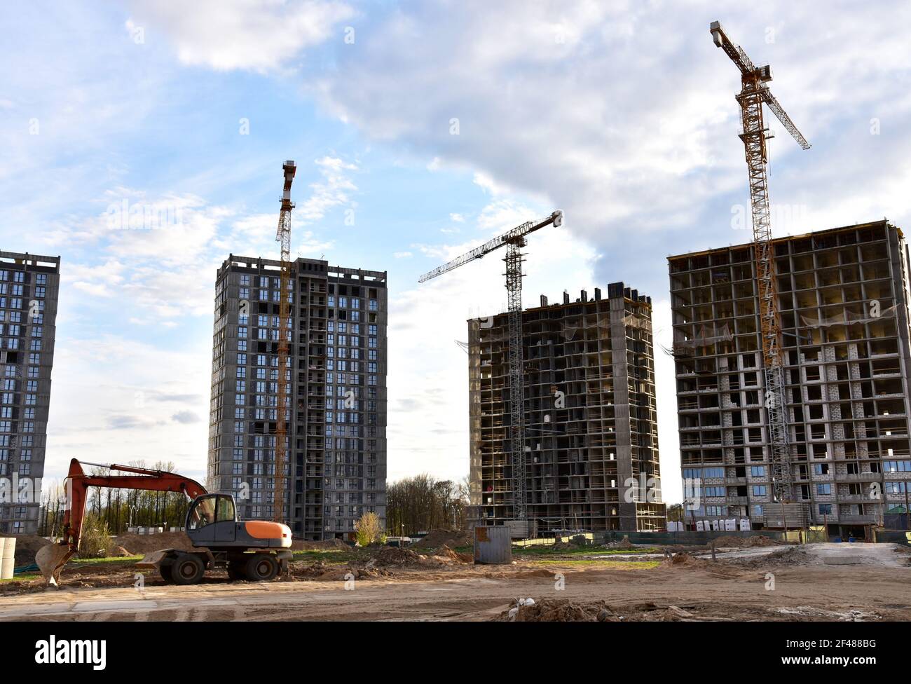 View of a large construction site. Excavator for earthworks. Tower ...