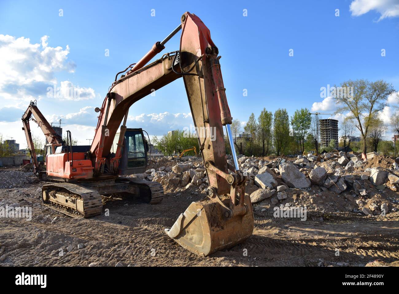 Excavator on demolition the old building. Backhoe the destruction of ...