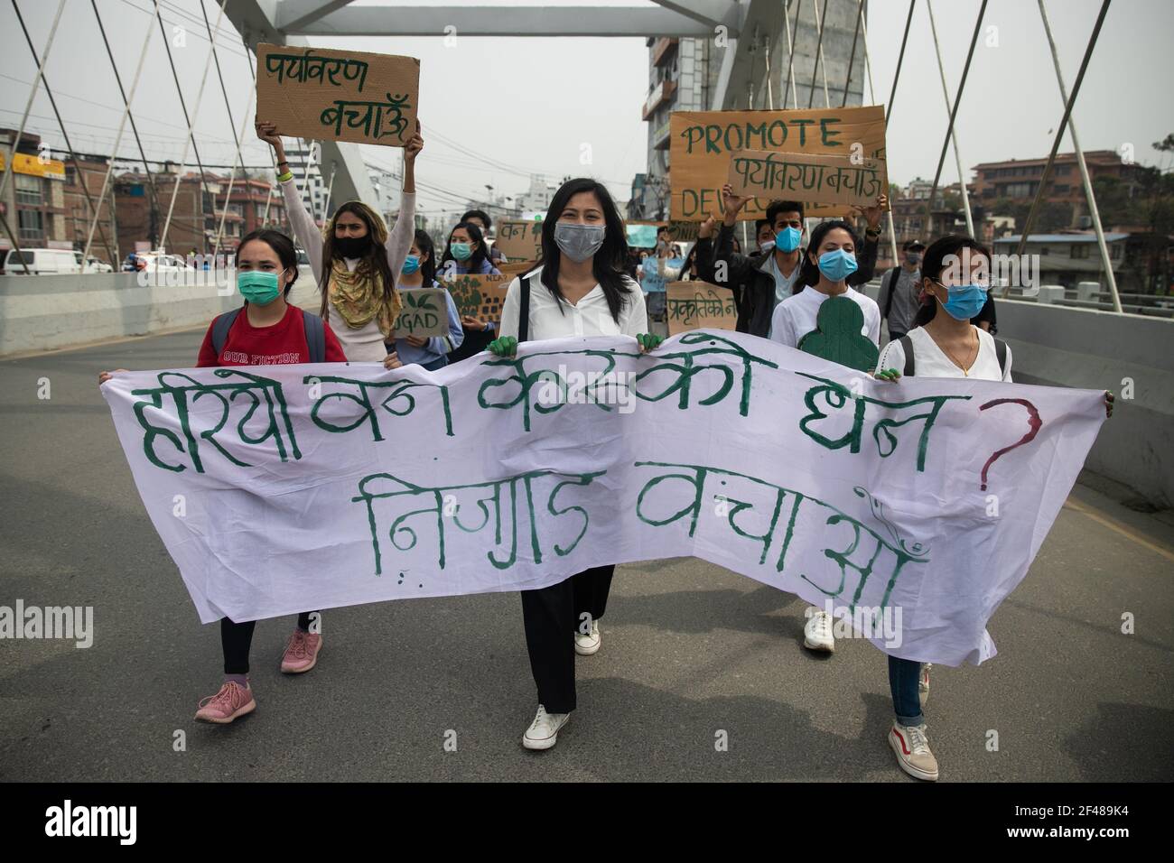 Environmental activists marching with a huge banner during the ...