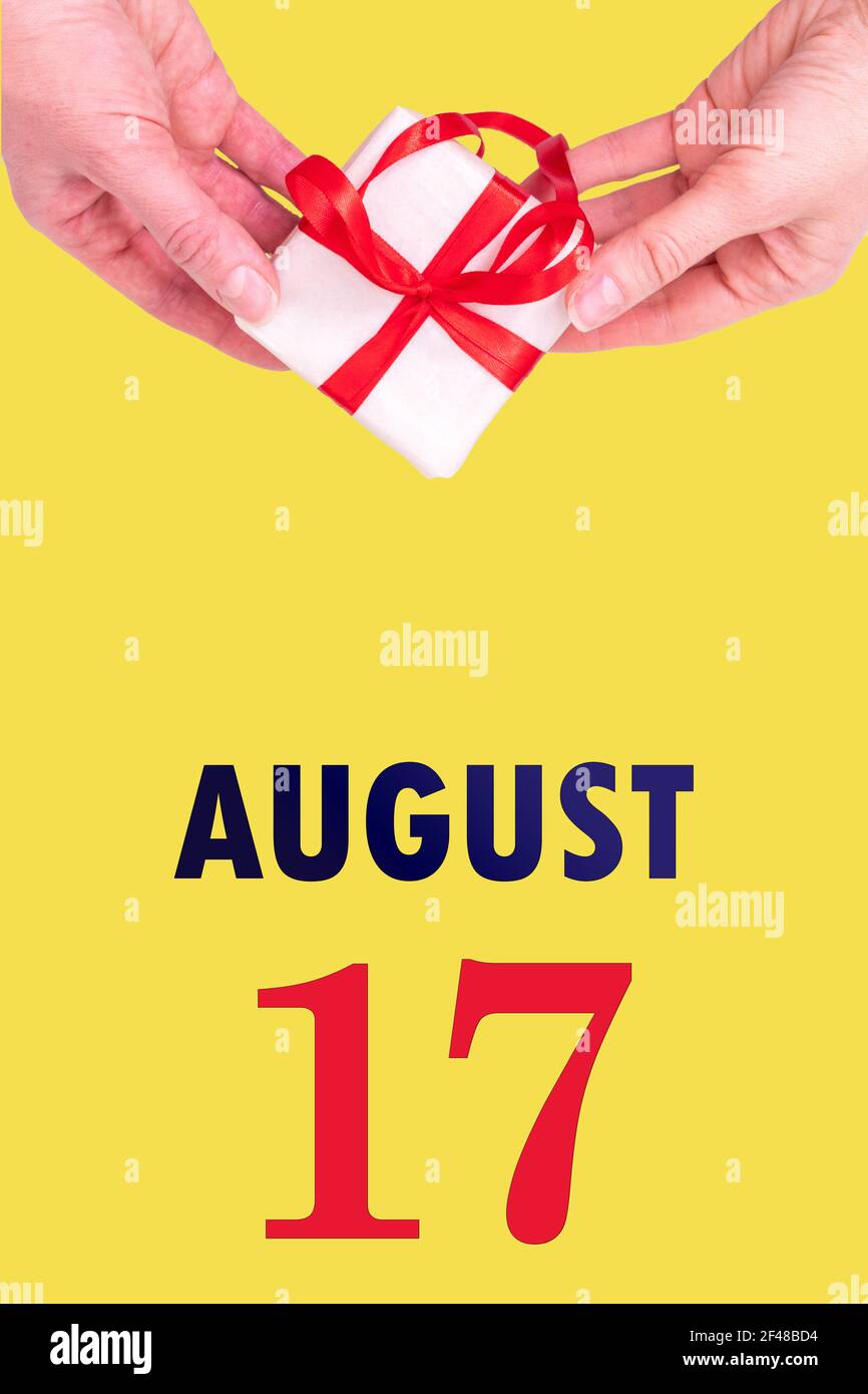 August 17th. Festive Vertical Calendar With Hands Holding White Gift ...