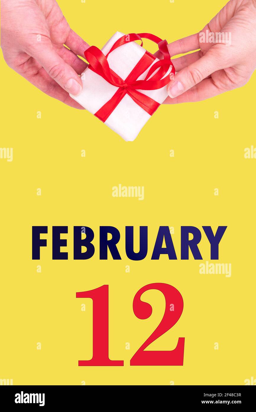 February 12th. Festive Vertical Calendar With Hands Holding White Gift ...