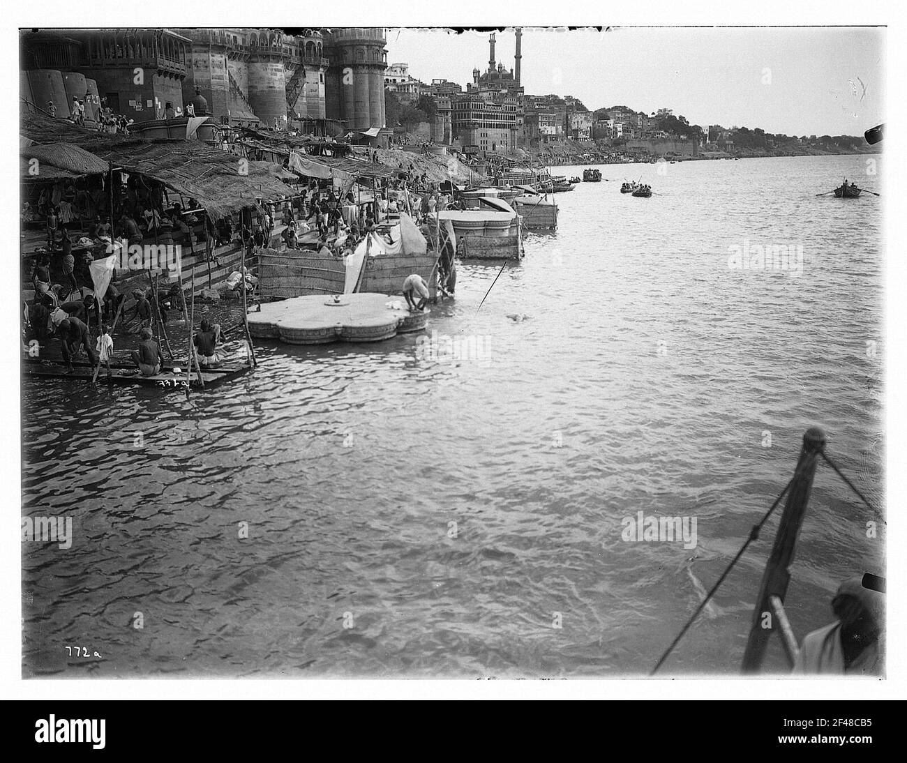 Varanasi (Benares), India. Ghats with pilgrims and temples on the shore ...