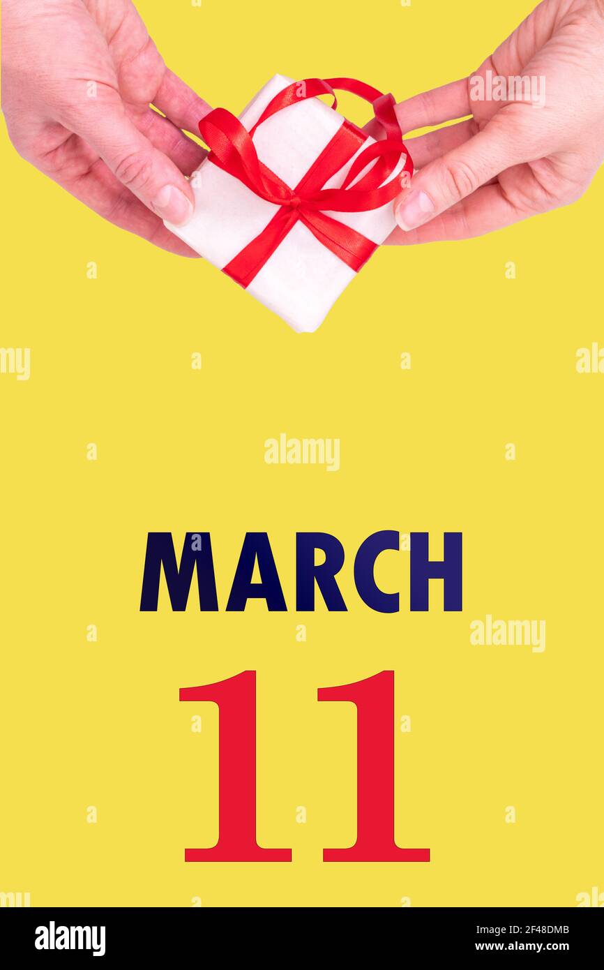 March 11th. Festive Vertical Calendar With Hands Holding White Gift Box ...
