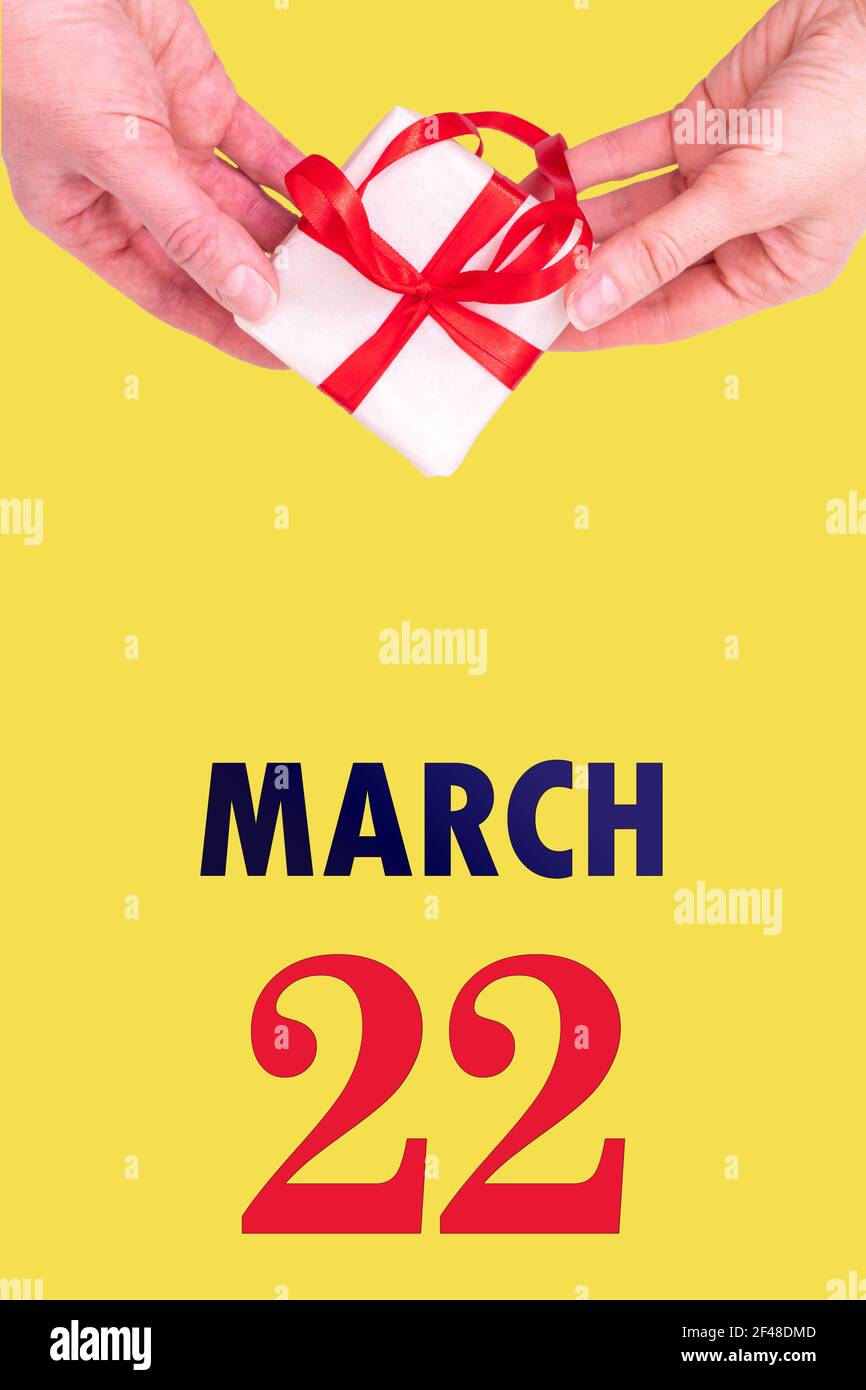 March 22nd. Festive Vertical Calendar With Hands Holding White Gift Box ...
