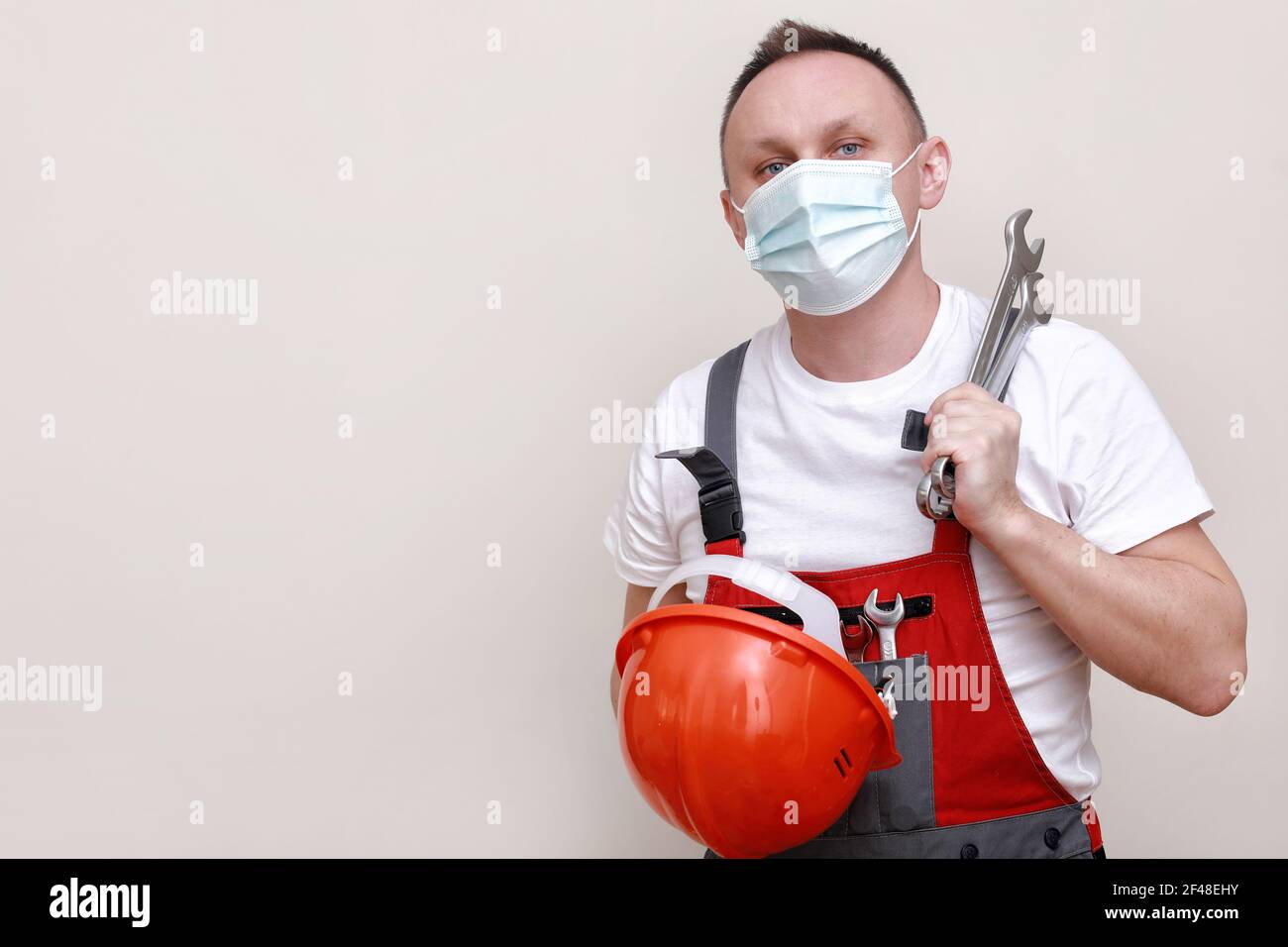 portrait engineer worker or mechanic wearing helmet and face mask for ...