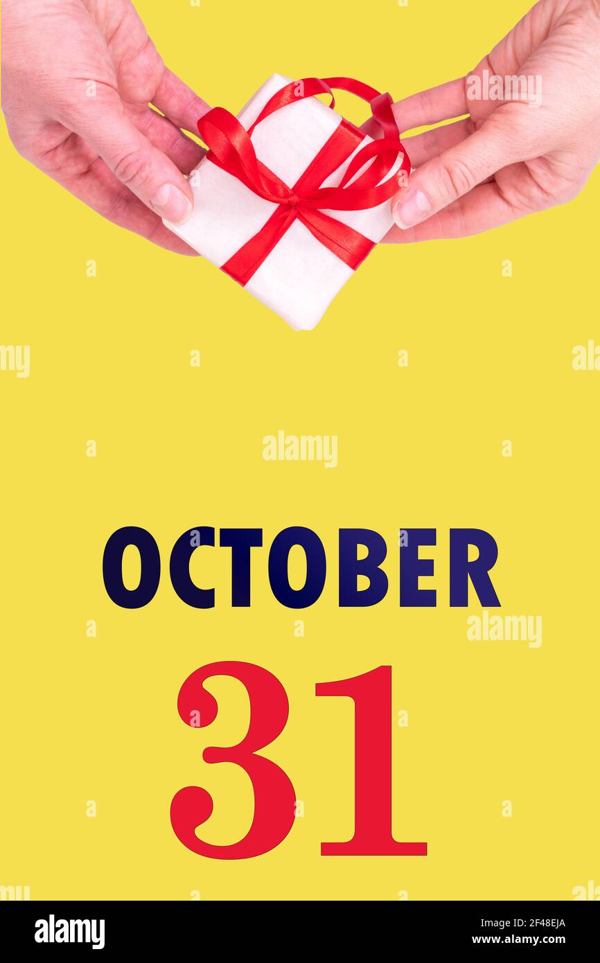 October 31st. Festive Vertical Calendar With Hands Holding White Gift ...
