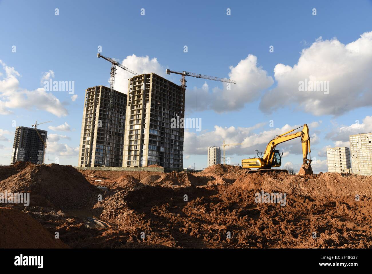 Excavator dig the trenches at a construction site. Trench for laying ...
