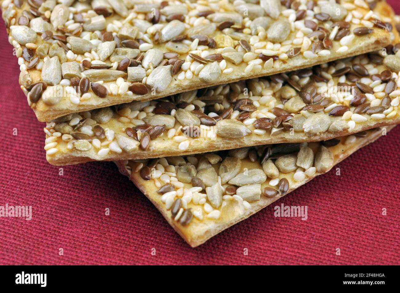 Flaky pastry cookies with seeds: sunflower, sesame and flax. Closeup ...