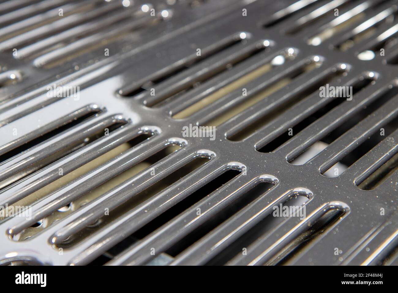 A brand new metal barbecue grill Stock Photo - Alamy