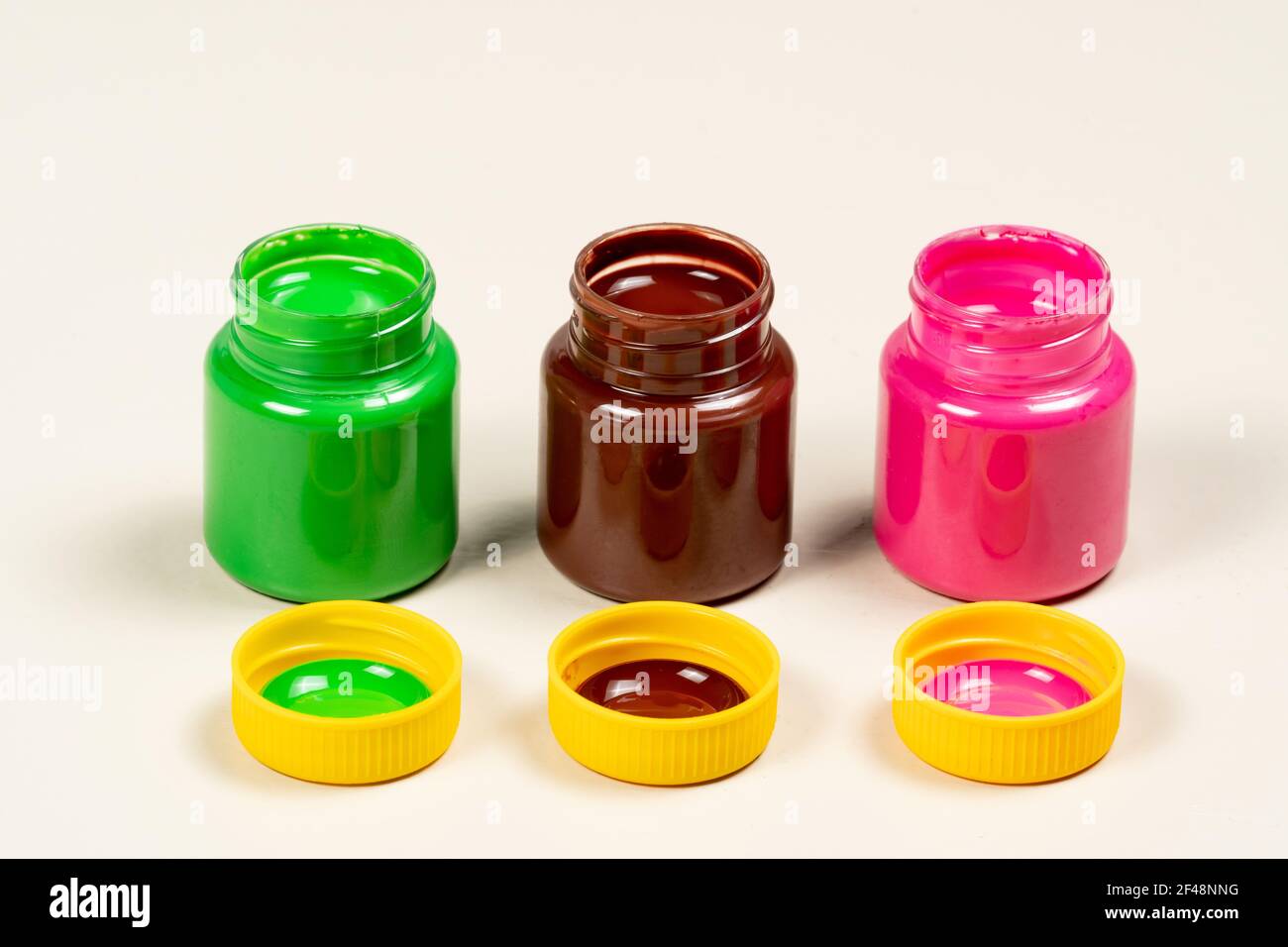 3 open gouache paint glass opened align Stock Photo - Alamy
