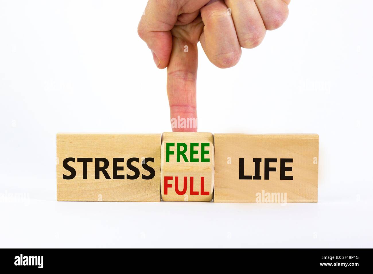 Stress free life symbol. Doctor turns a cube and changes words 'stress ...